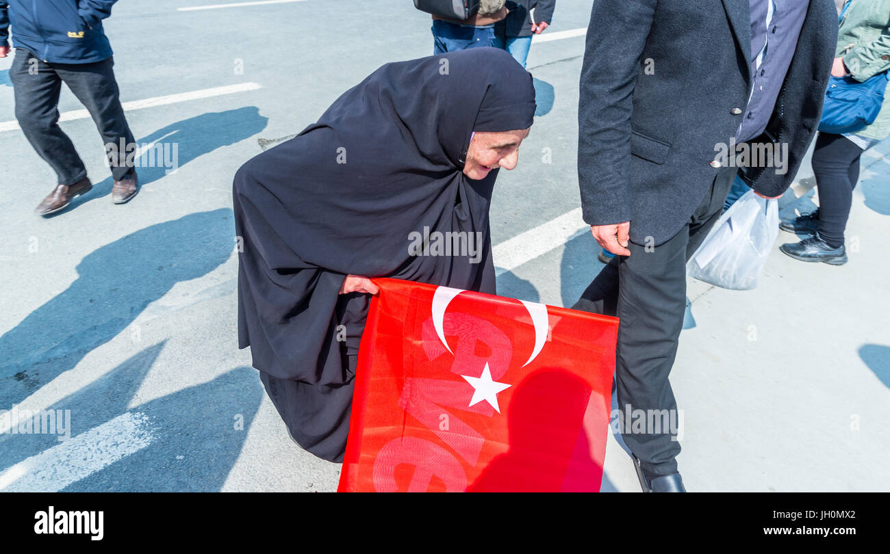 AKP (Justice and Development Party) supporters shout slogans and wave ...