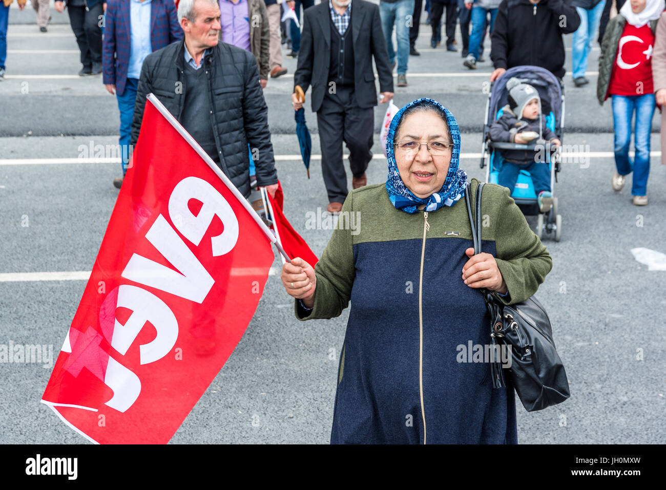 AKP (Justice and Development Party) supporters shout slogans and wave ...
