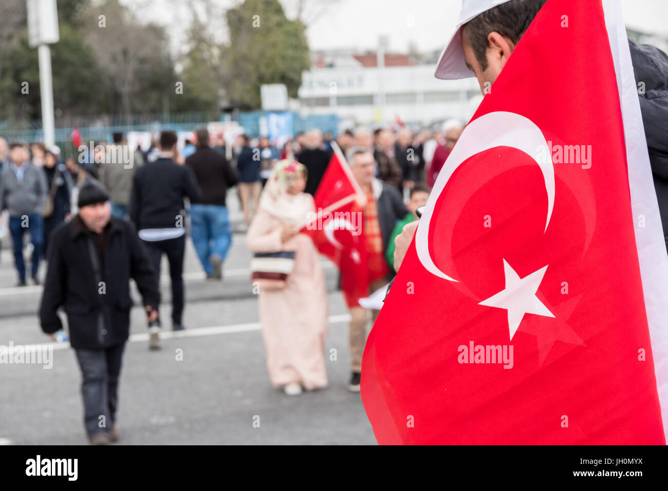 AKP (Justice and Development Party) supporters shout slogans and wave ...