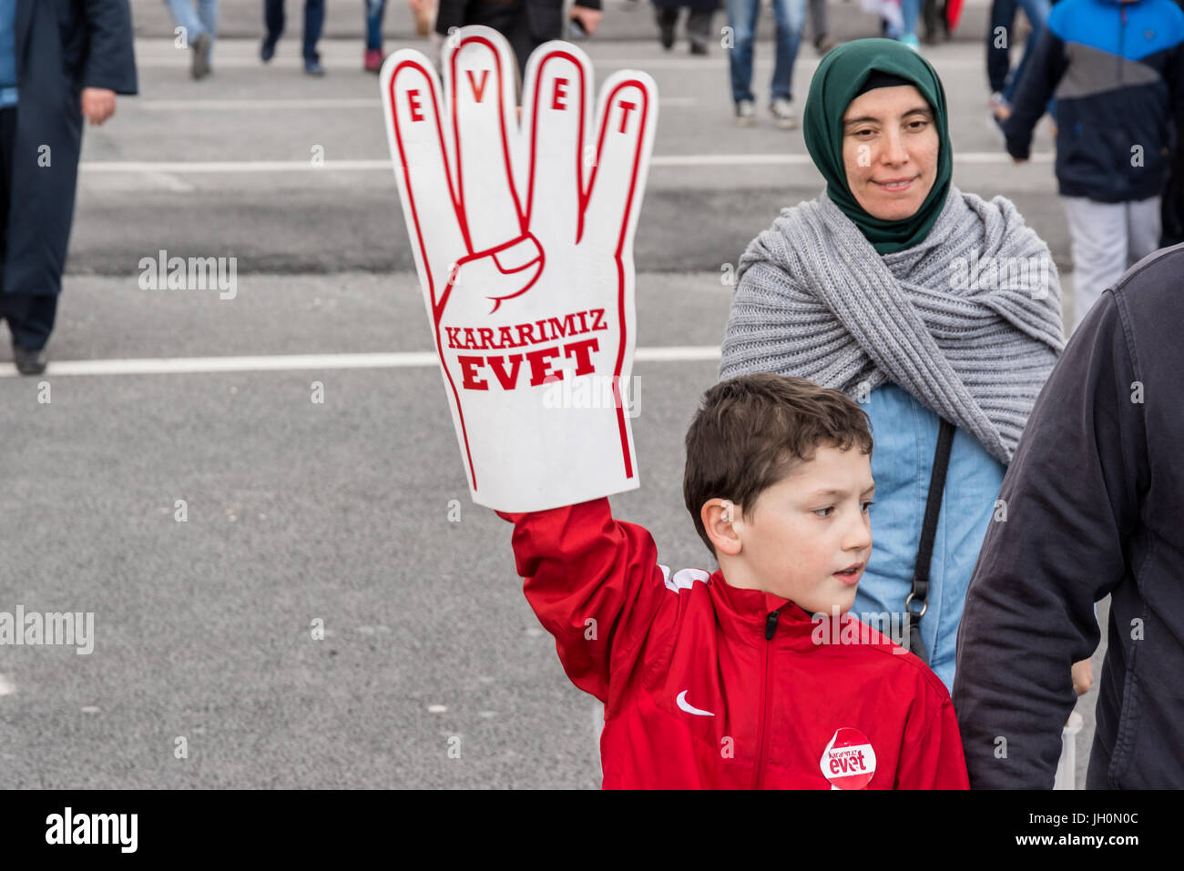 AKP (Justice and Development Party) supporters shout slogans and wave ...