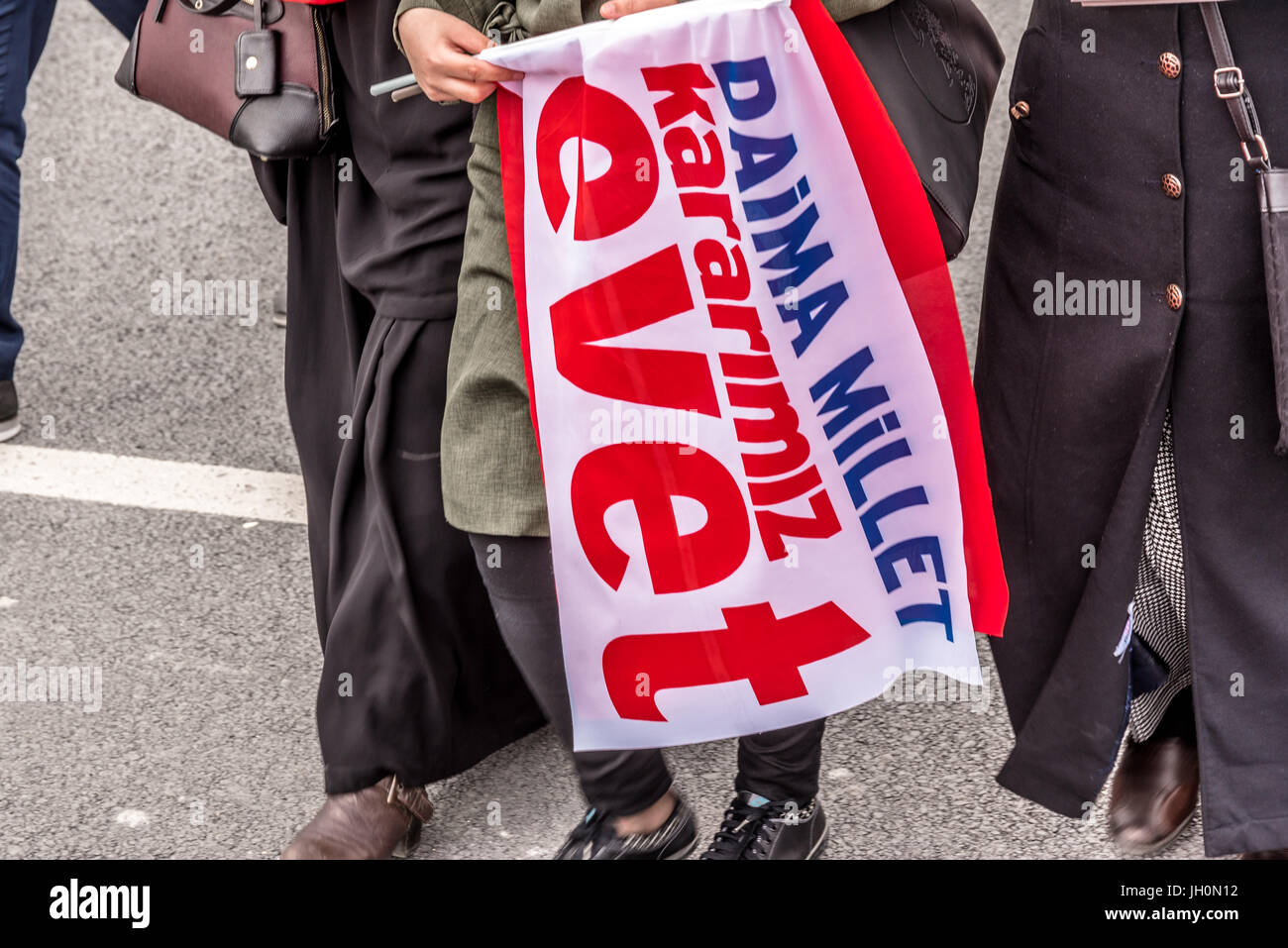 AKP (Justice and Development Party) supporters shout slogans and wave ...