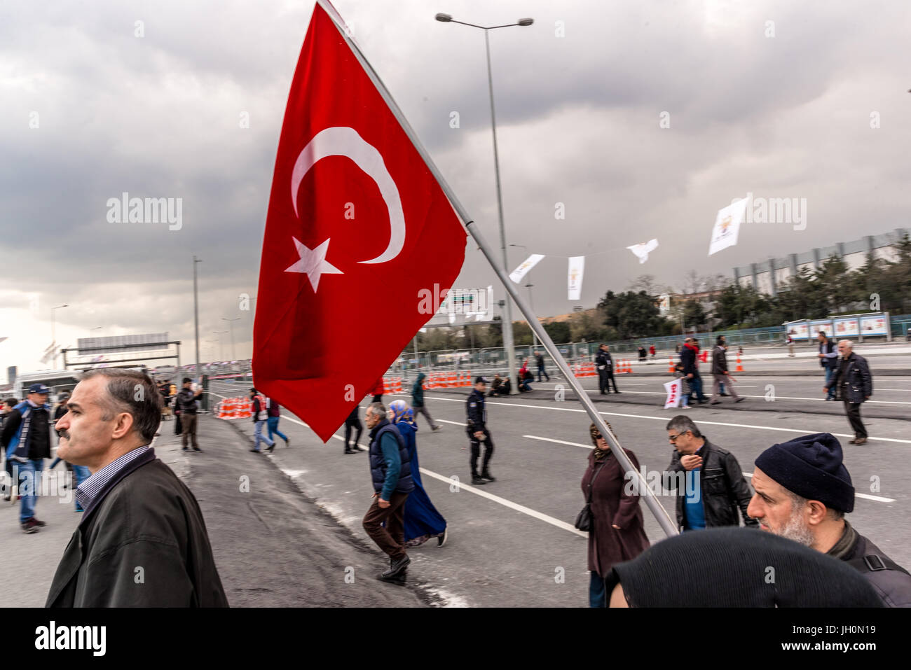 AKP (Justice and Development Party) supporters shout slogans and wave ...