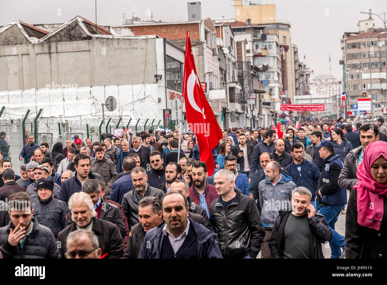 AKP (Justice and Development Party) supporters shout slogans and wave ...