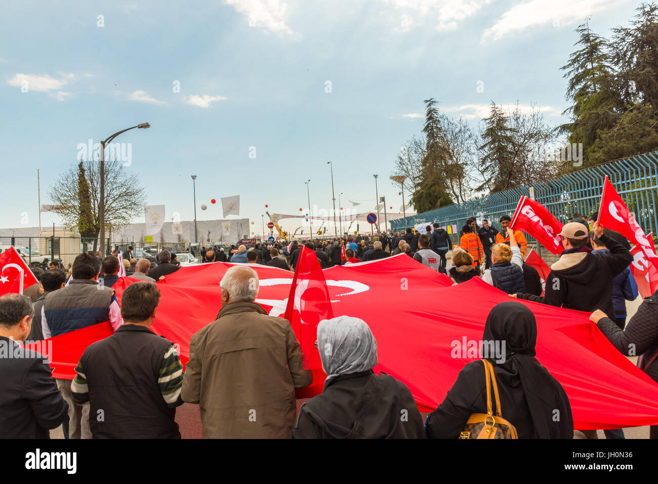 AKP (Justice and Development Party) supporters shout slogans and wave ...