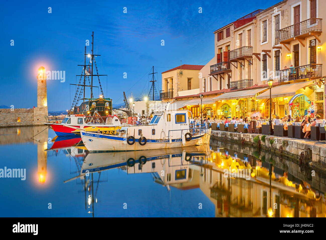 Evening at Old Venetian Port, lighthouse in the background, Rethymno ...