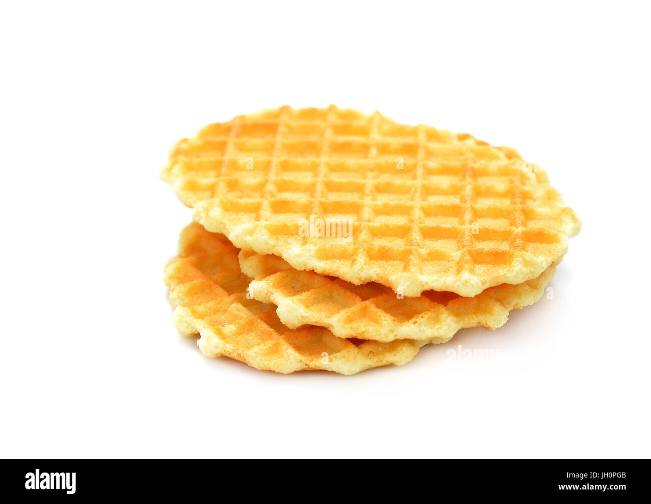 A stack of golden round waffles isolated on white background.Set of ...