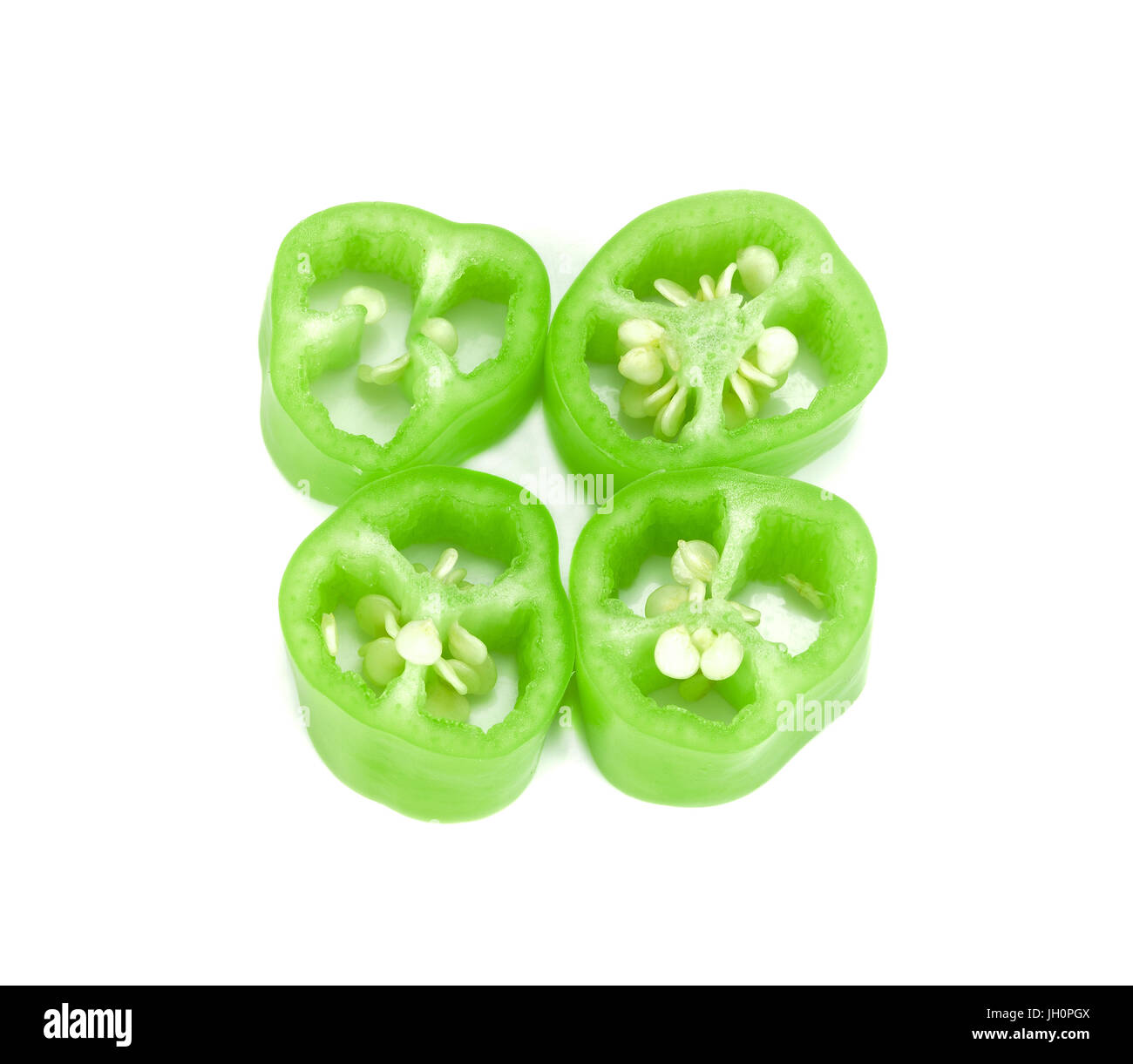 Sliced green pepper isolated on white, Chilli slice Stock Photo - Alamy