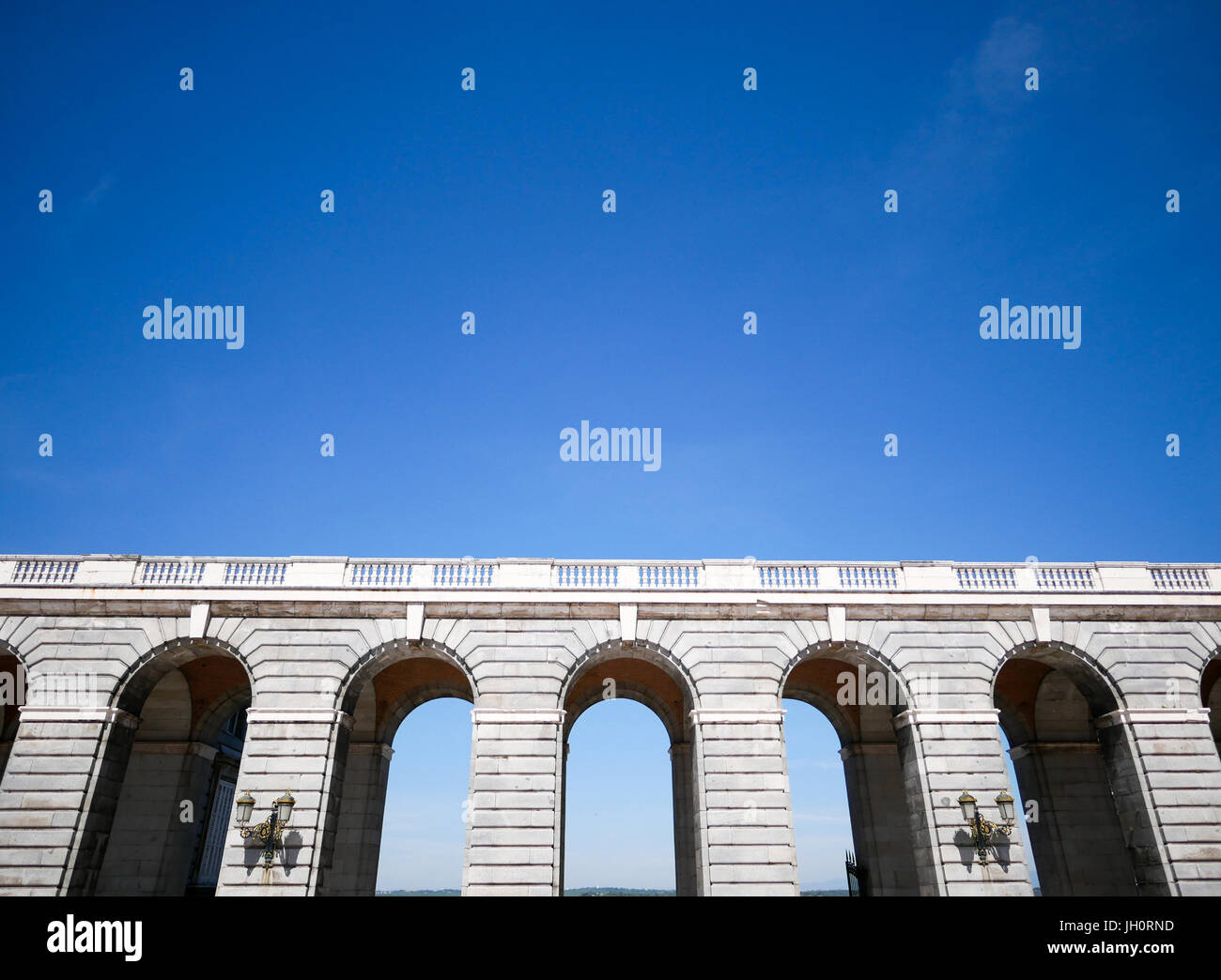 Side view of corridor archway at Palacio Real de Madrid or Royal Palace ...