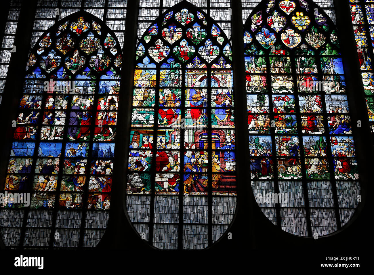 16th-century stained glass windows set in the north wall of Saint Joan ...