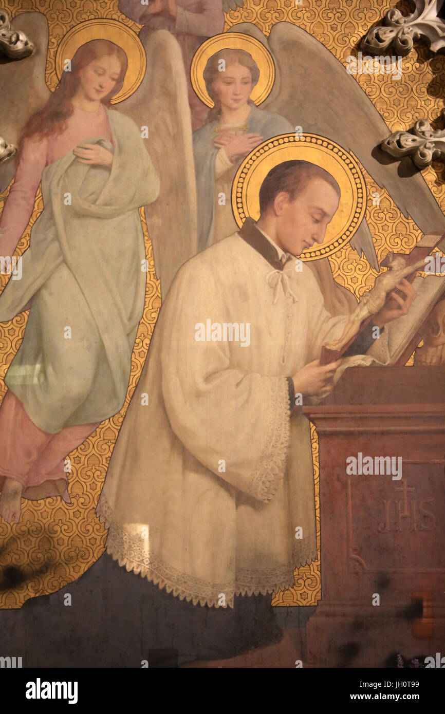 Priest praying with a crucifix. Painting. Saint-Nizier Church. Lyon ...
