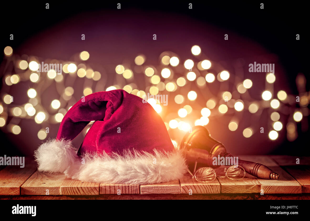 santa claus cap glasses and blurred lights Stock Photo - Alamy