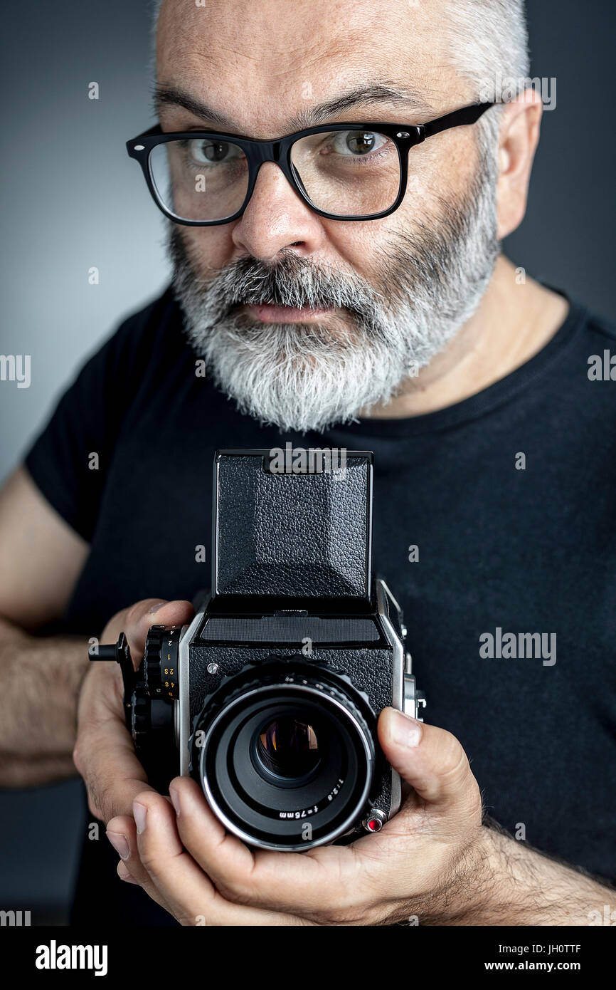 photographer with medium format film camera Stock Photo - Alamy