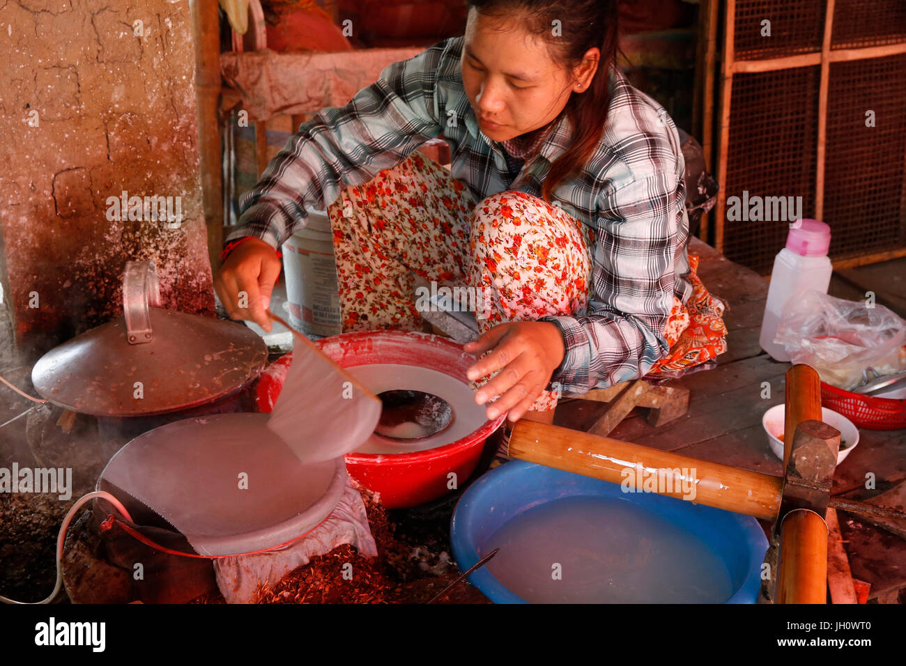 Rice paper factory financed by a loan from AMK microfinance. Cambodia ...