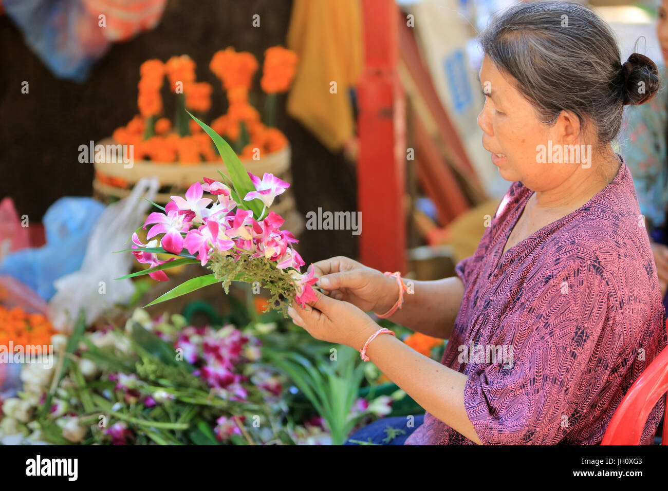 With offerings of flowers hi-res stock photography and images - Alamy