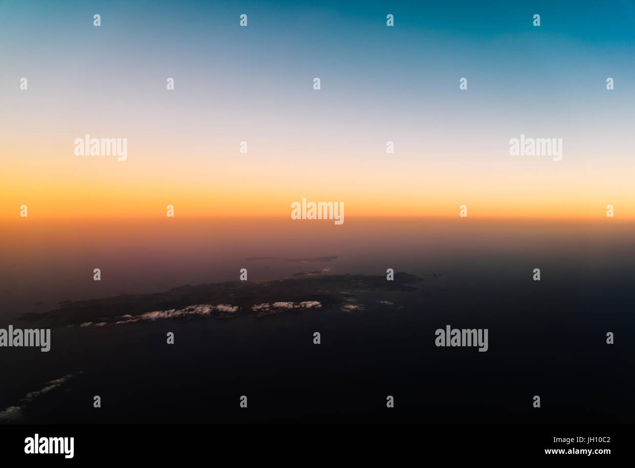 Aerial Photo Of Ocean Sunset Over Island Stock Photo - Alamy