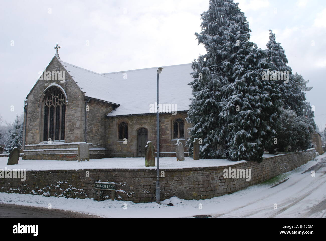 Snow covered village church Stock Photo - Alamy