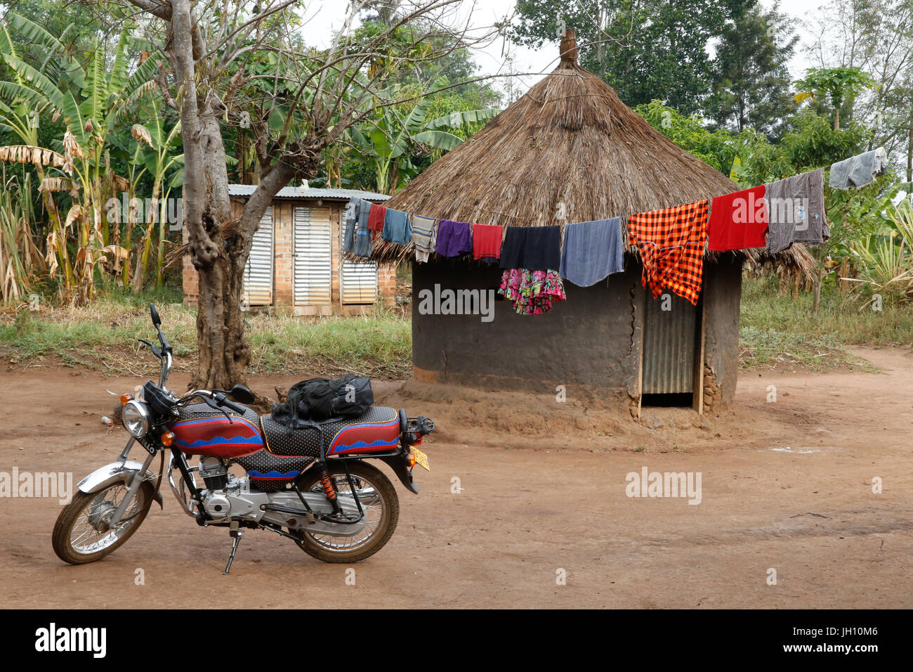 Motorcycle and home. Uganda Stock Photo - Alamy
