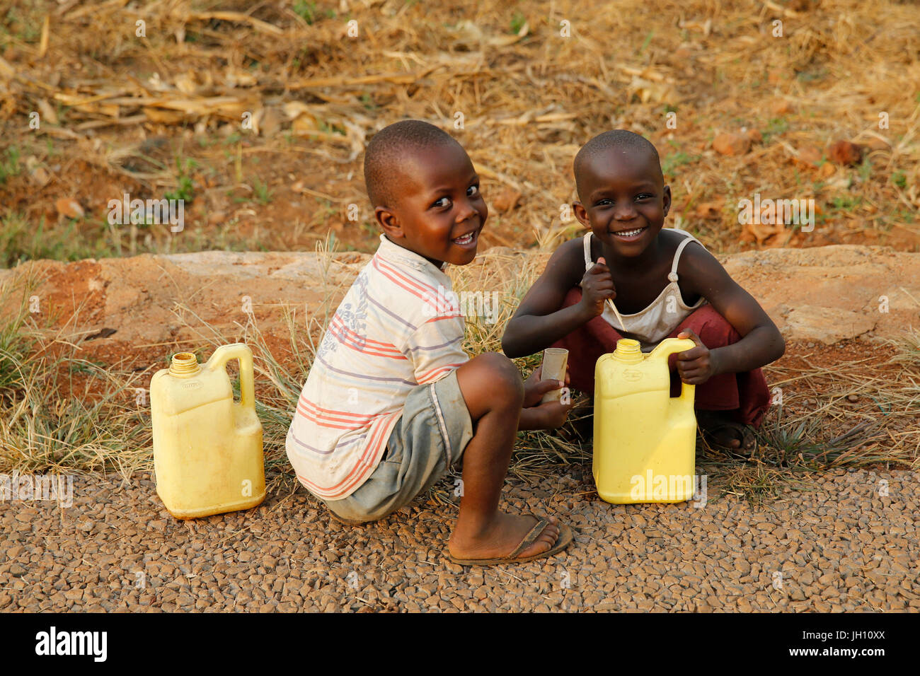 Boy fetching water hi-res stock photography and images - Alamy