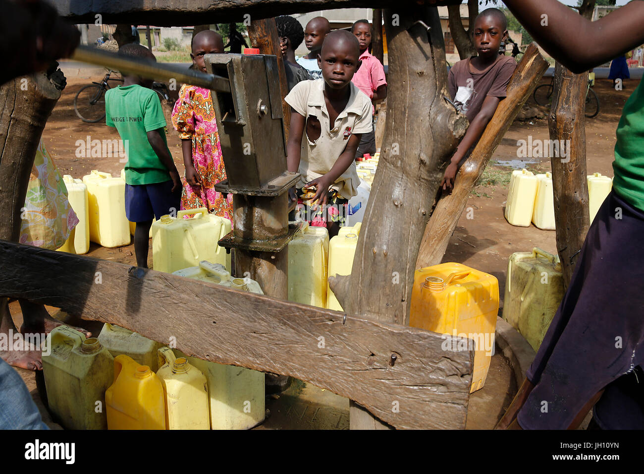 Boy fetching water hi-res stock photography and images - Alamy