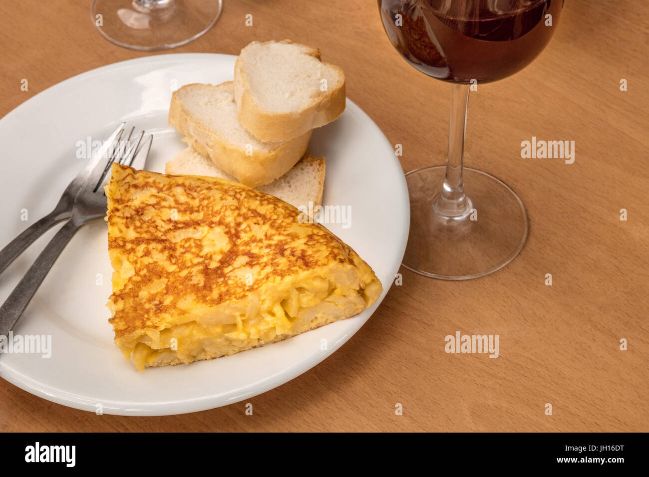 Spanish tortilla with wine, tapas in local bar Stock Photo - Alamy