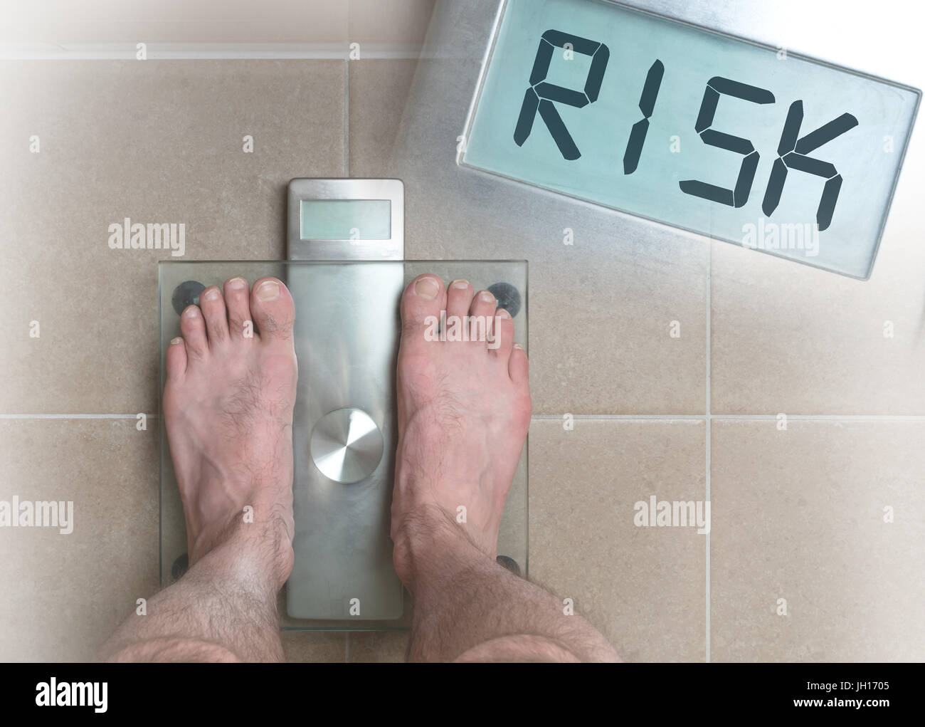Closeup of man's feet on weight scale - Risk Stock Photo - Alamy