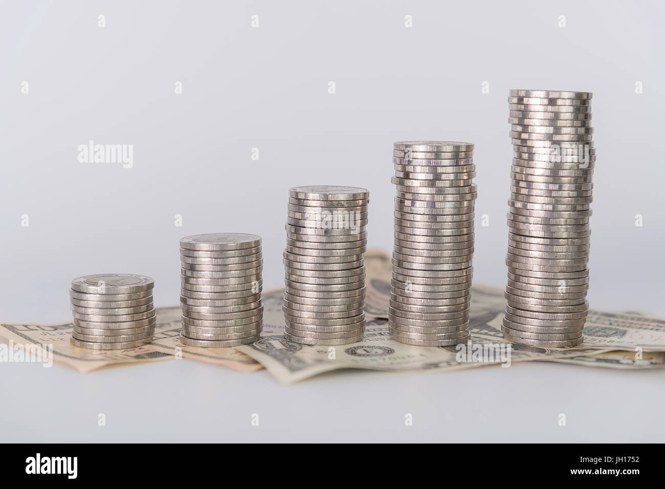Savings, increasing columns of coins, piles of coins arranged as a ...