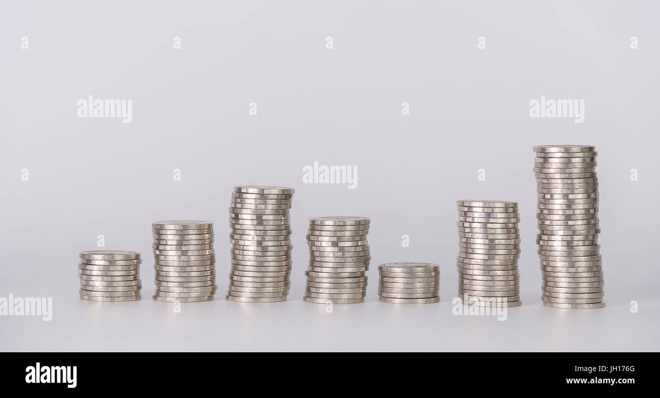 Savings, increasing columns of coins, piles of coins arranged as a ...