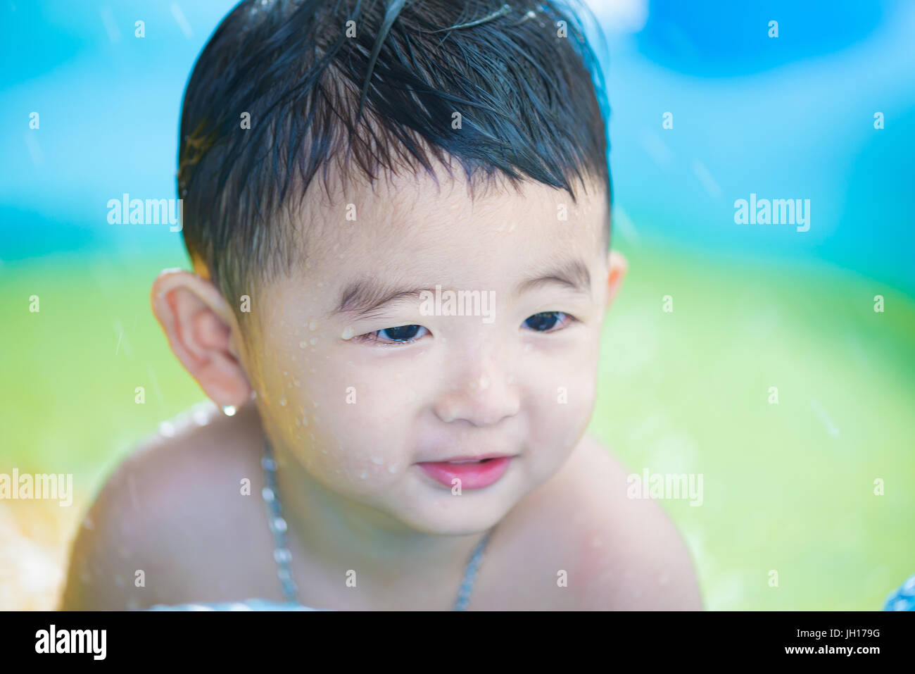Asian boy playing in waterfall hi-res stock photography and images - Alamy
