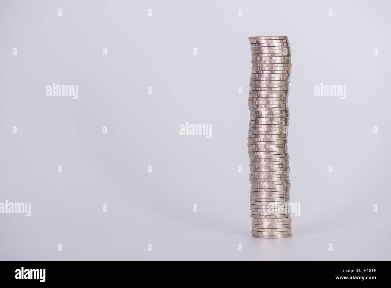 Columns of coins, piles of coins arranged on white background, business ...
