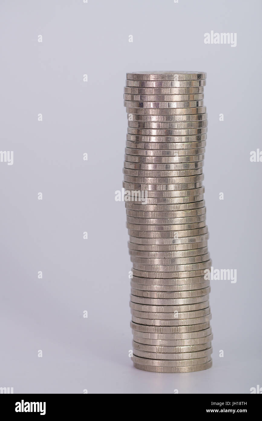 Columns of coins, piles of coins arranged on white background, business ...