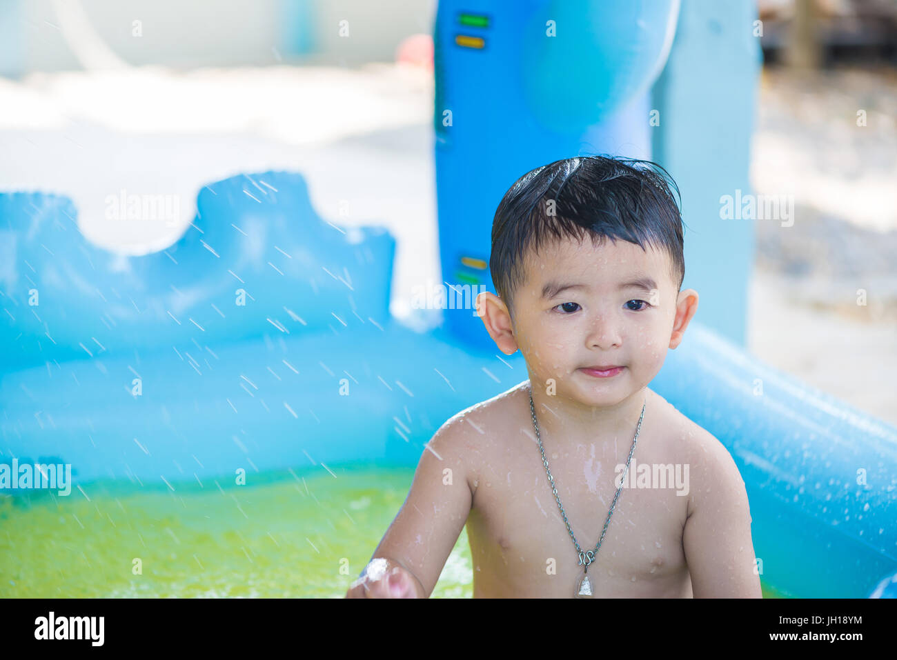 Asian boy playing in waterfall hi-res stock photography and images - Alamy