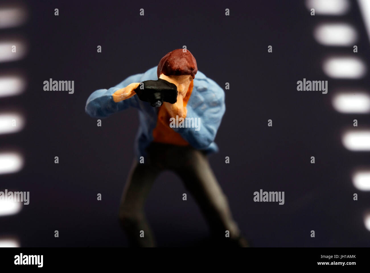 miniature figurine of a photographer, photography and paparazzi concept ...