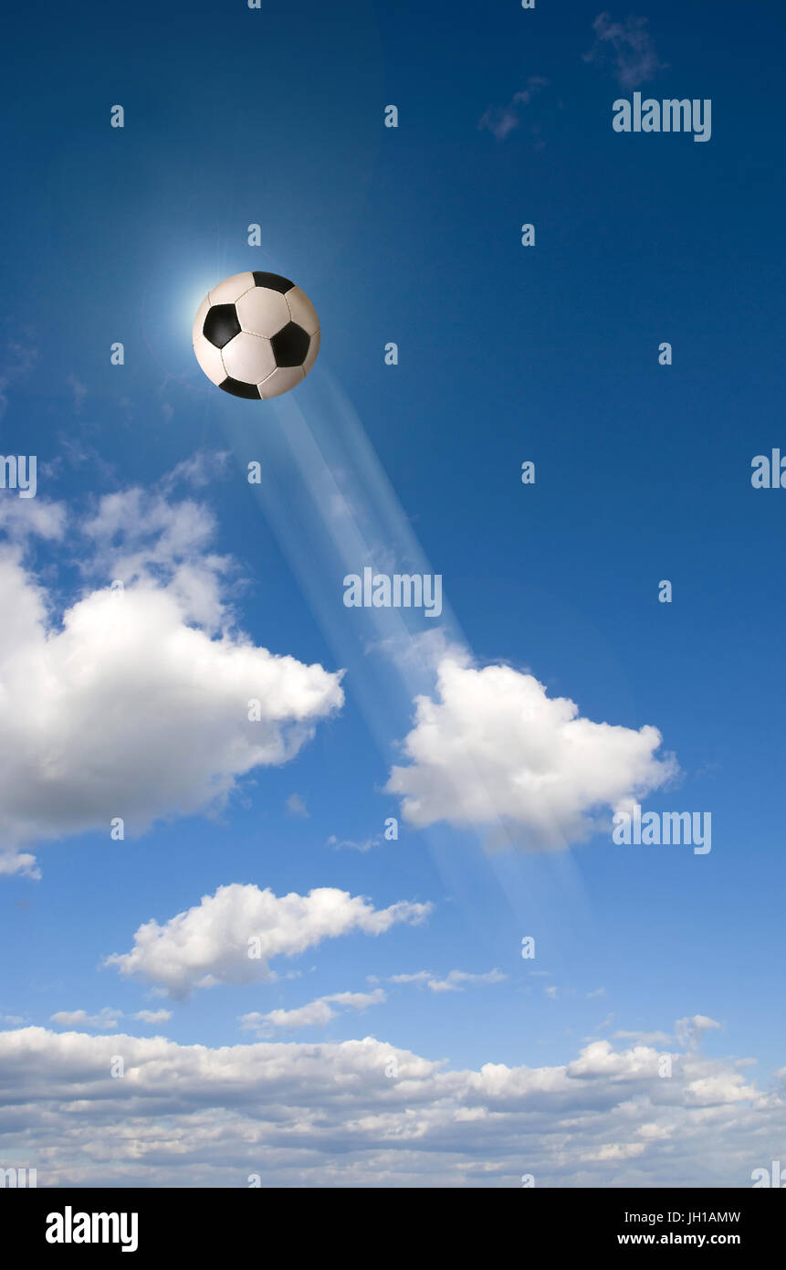 football flying into the sky Stock Photo - Alamy
