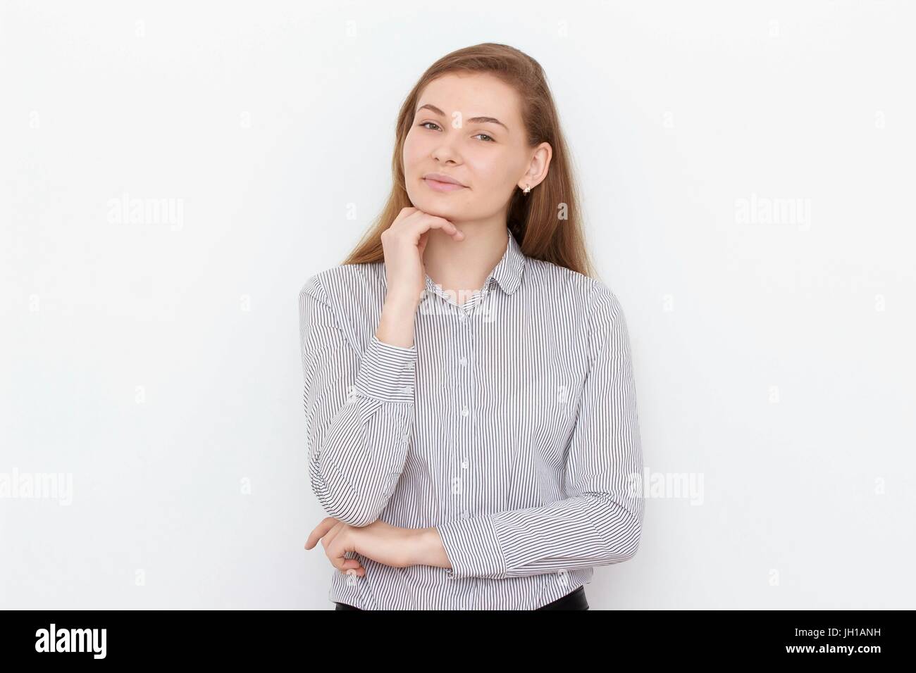Happy young student girl with folded arms isolated on white background ...