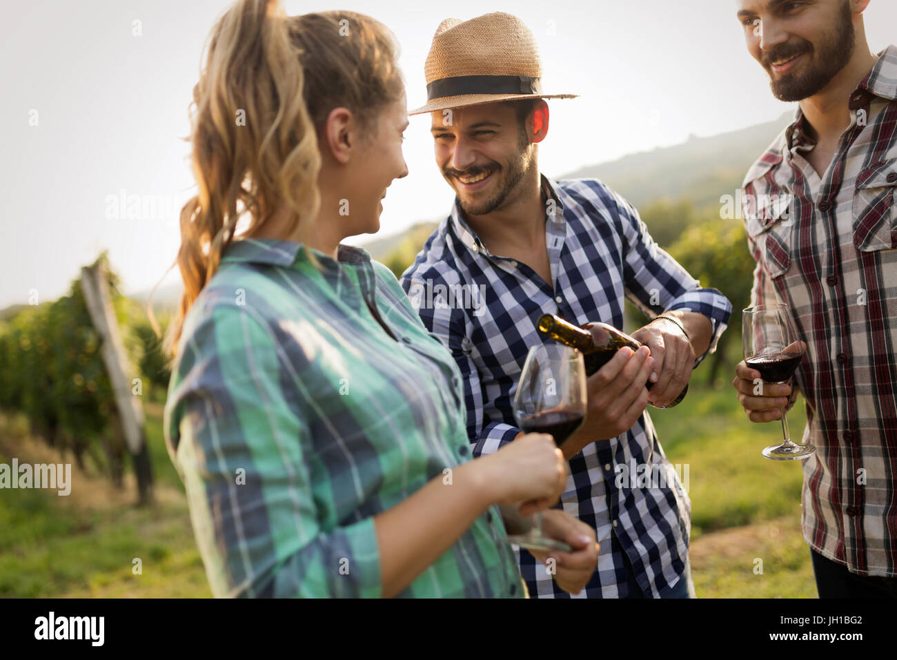 People sampling and tasting wines in vineyard Stock Photo - Alamy