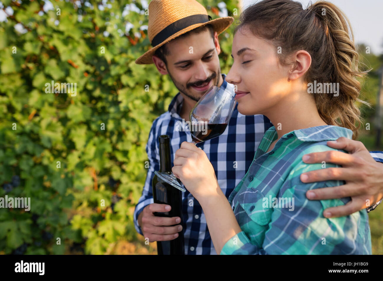 People tasting wine in vineyard Stock Photo - Alamy
