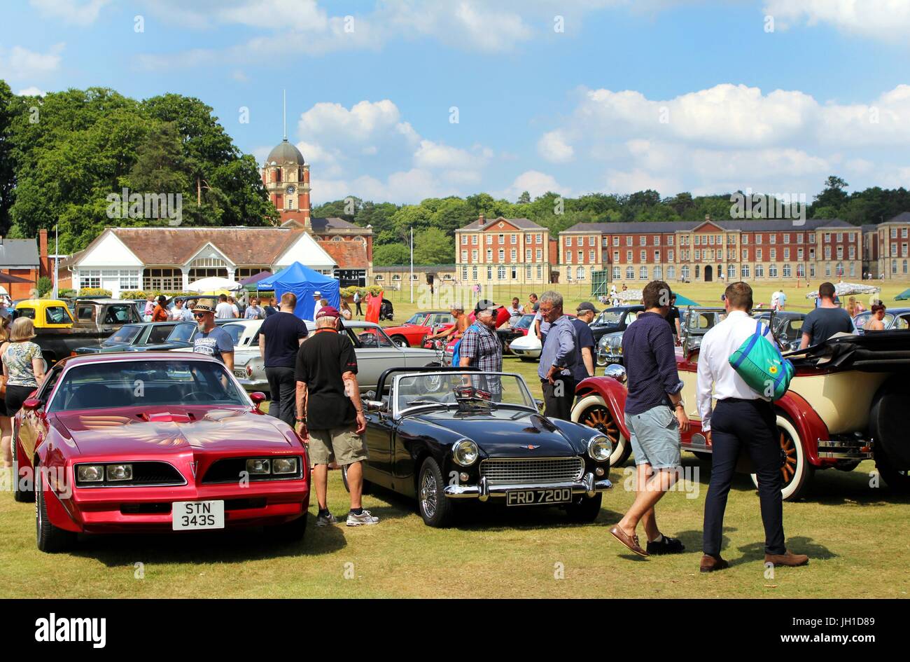 Visitors and motor enthusiasts looking at classic and vintage cars at a ...