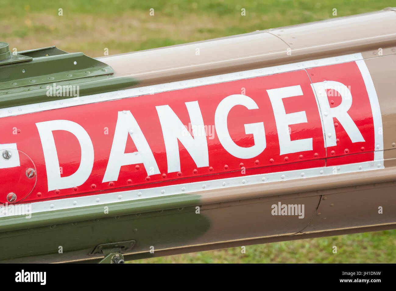 closeup of a danger sign on the fuselage of a vintage helicopter Stock ...