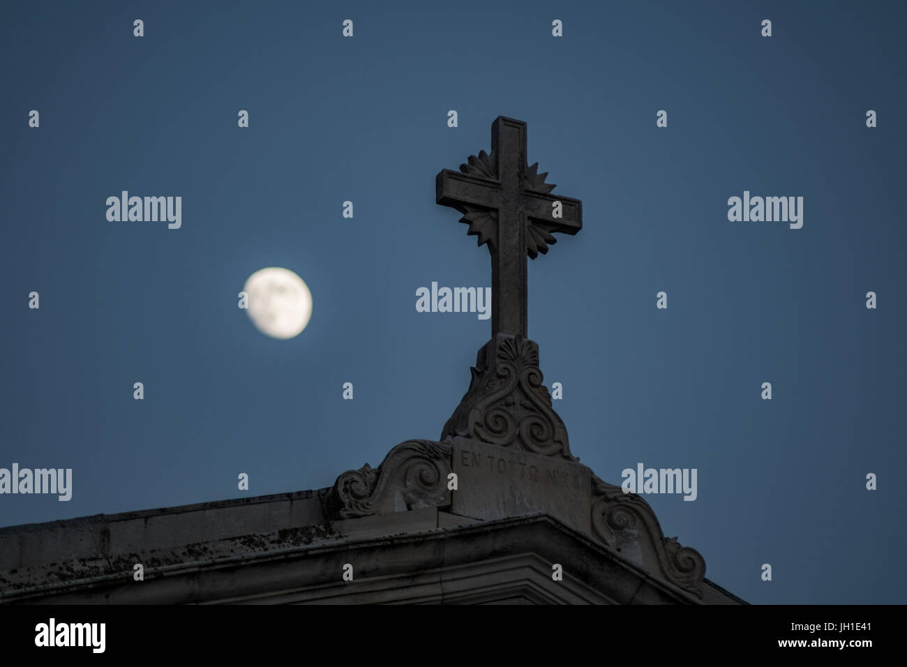Medieval Cross under the moon Stock Photo - Alamy