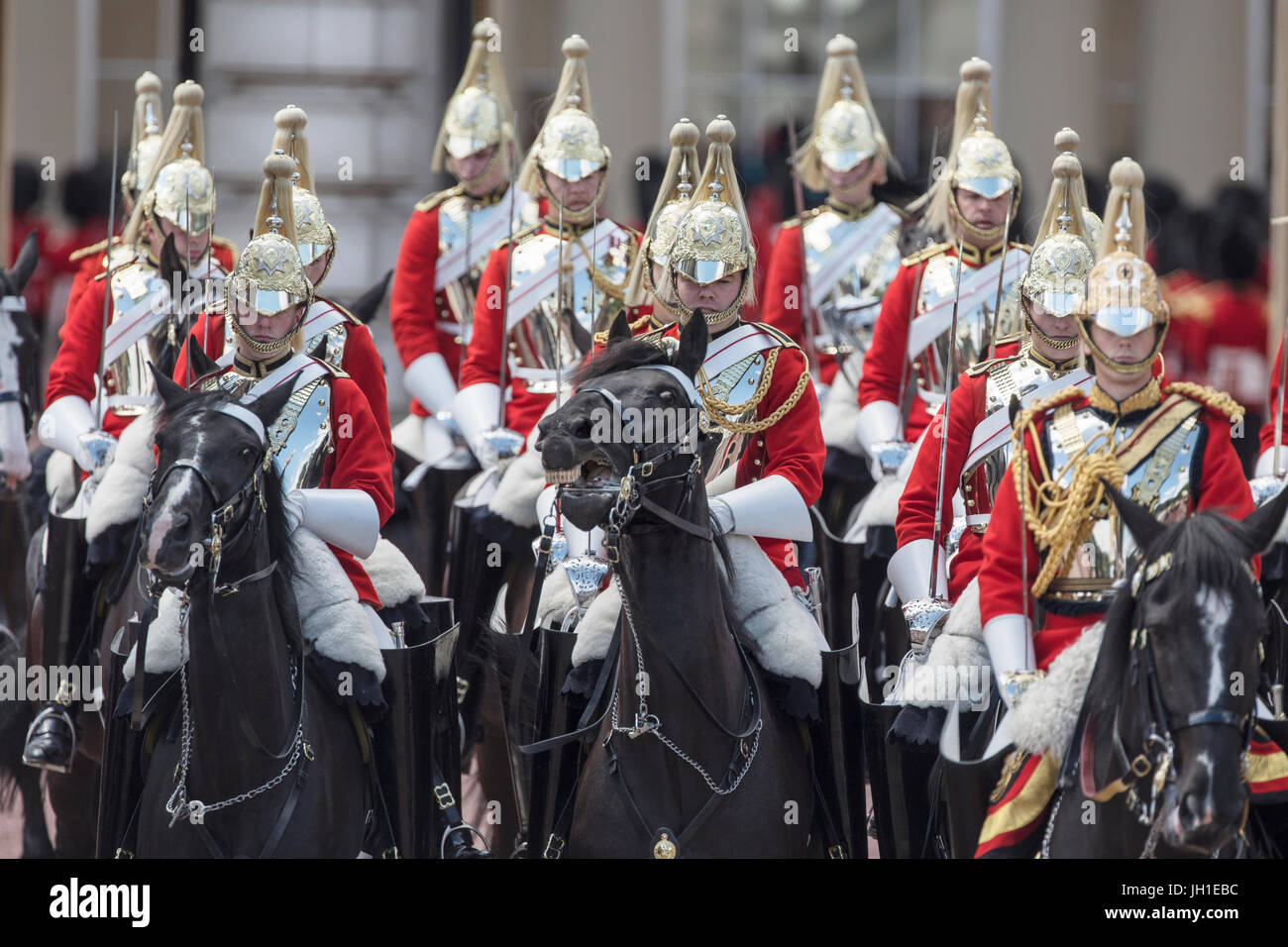 Members of the Household Cavalry riding ahead of a state carriage ...