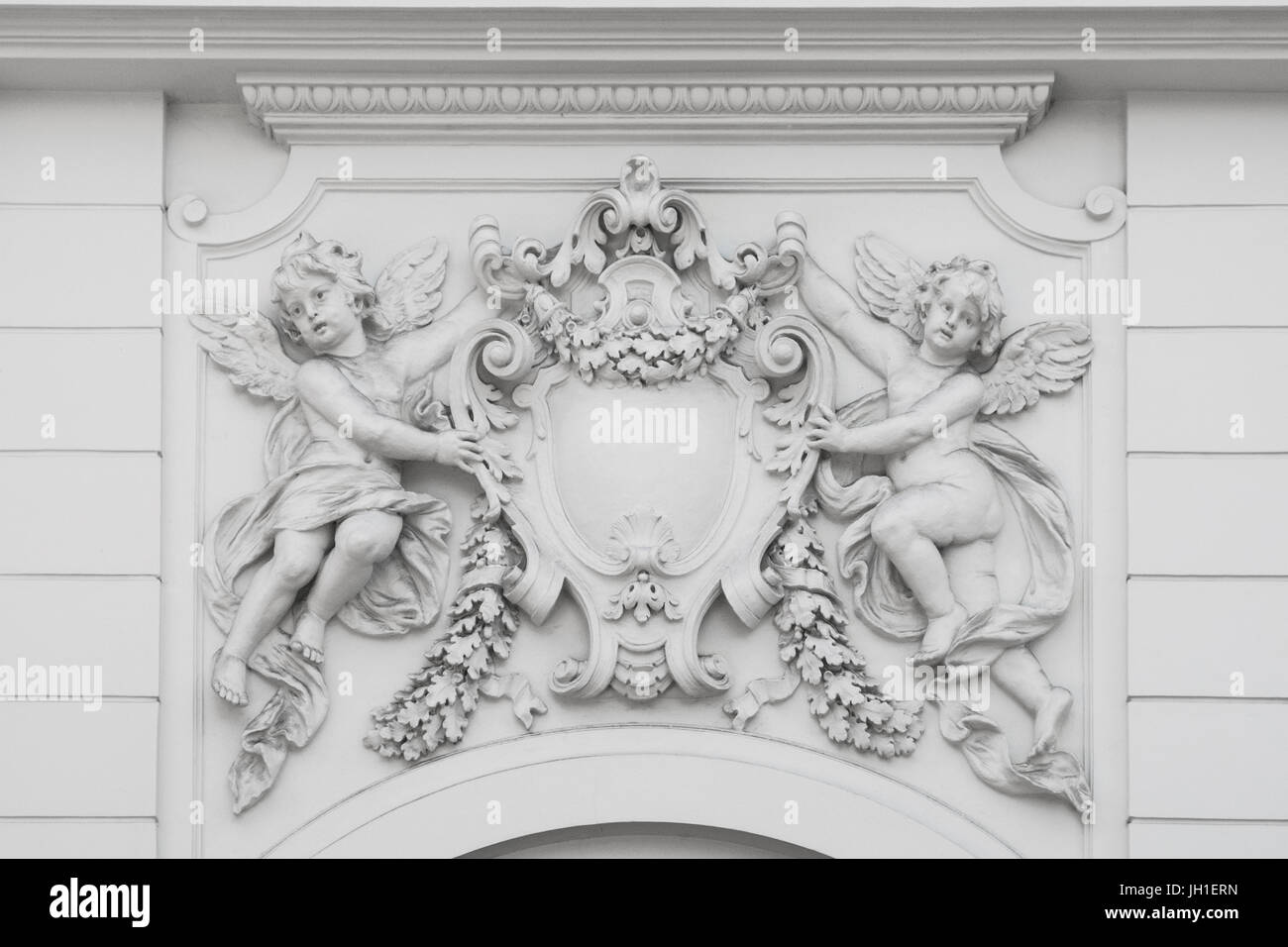 beautiful building decoration - angel statues holding emblem ...