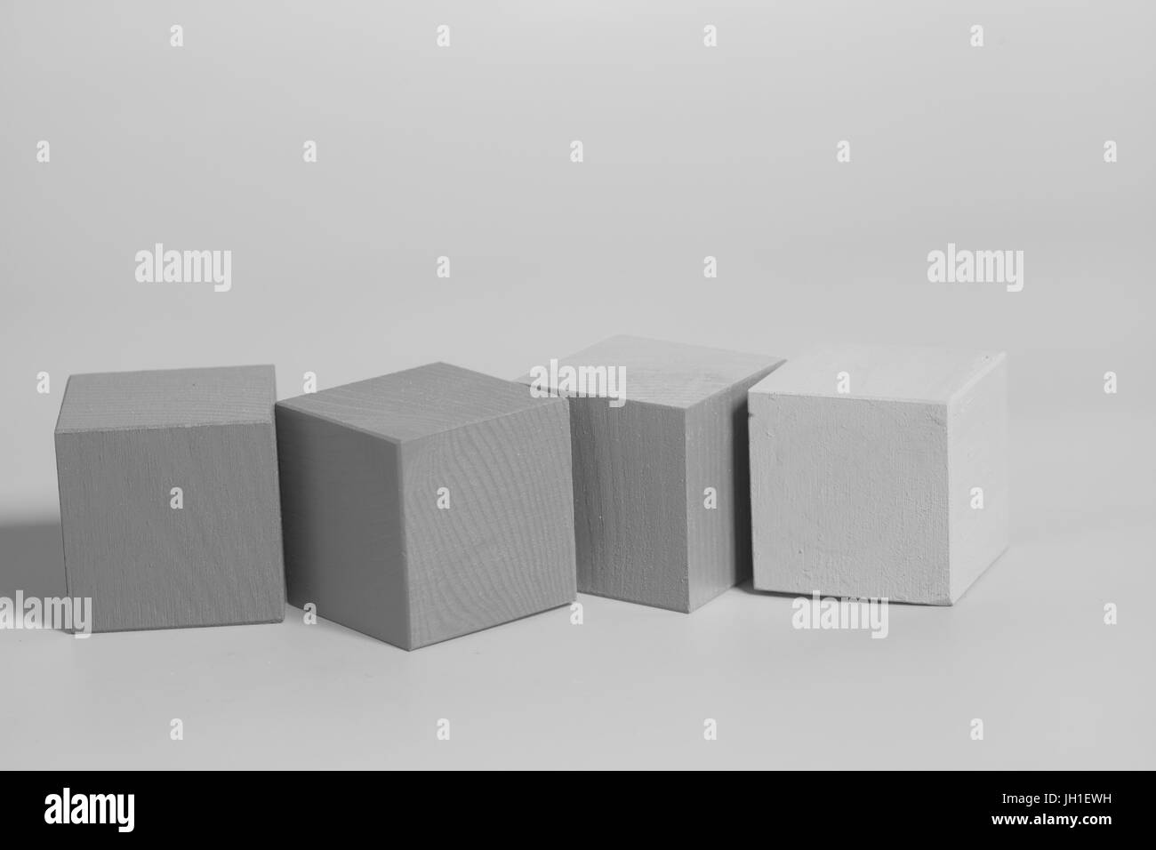 Wooden cubes on gray background Stock Photo - Alamy