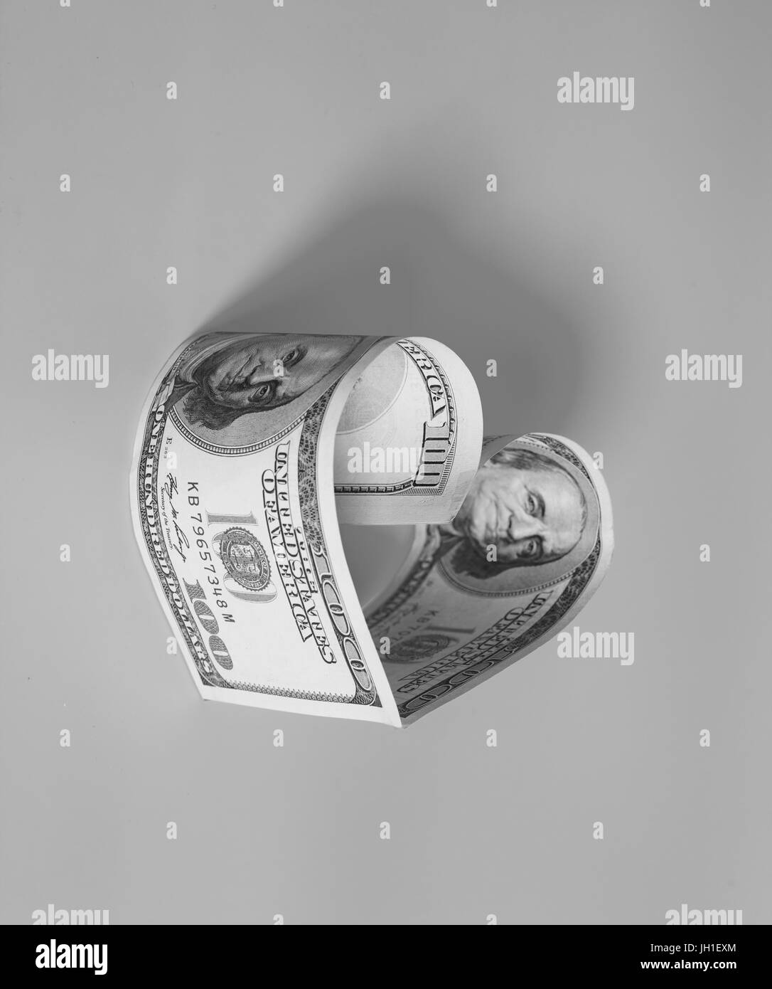 100 dollar bill in heart shape hi-res stock photography and images - Alamy