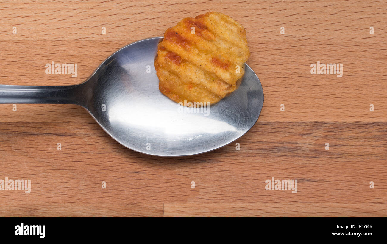 Spoon and Potato chips Stock Photo - Alamy