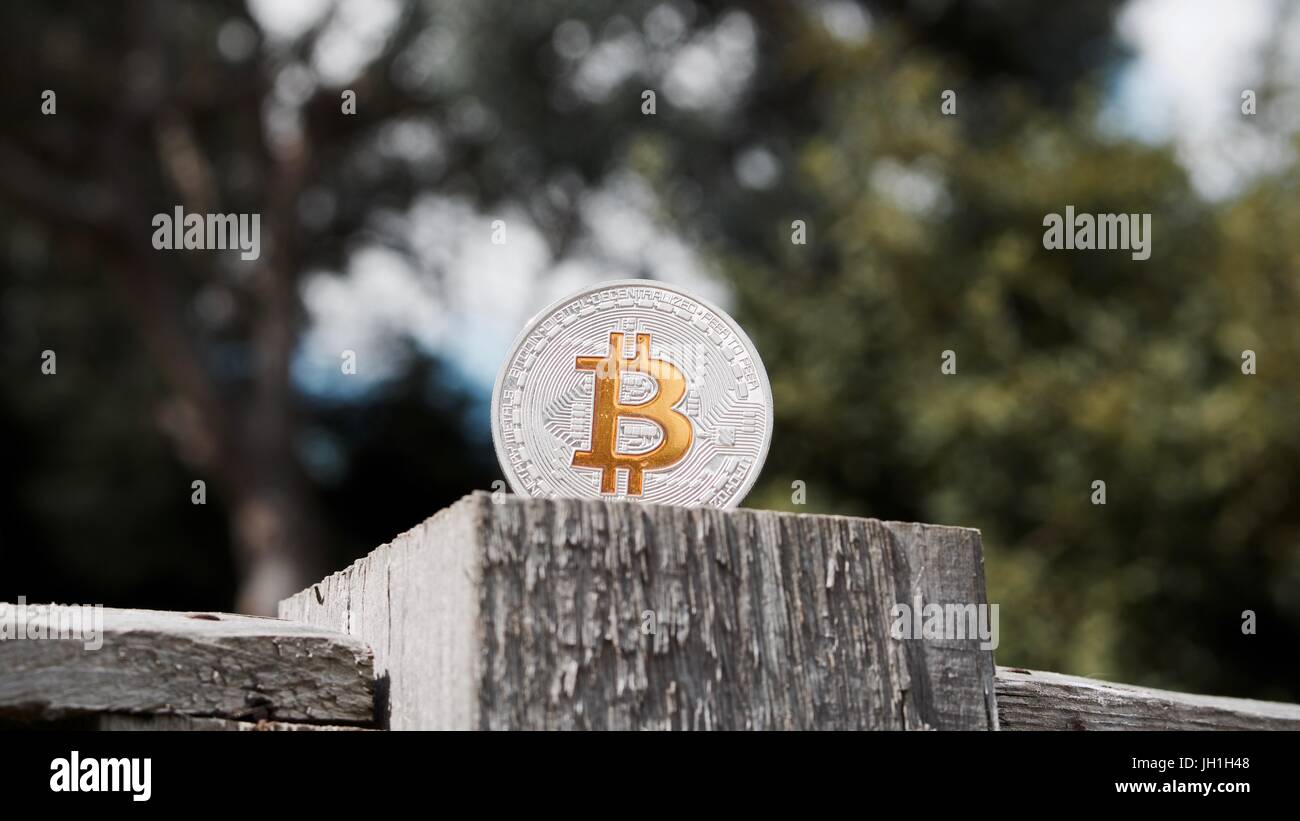 Digital currency physical silver bitcoin coin with yellow sign in ...