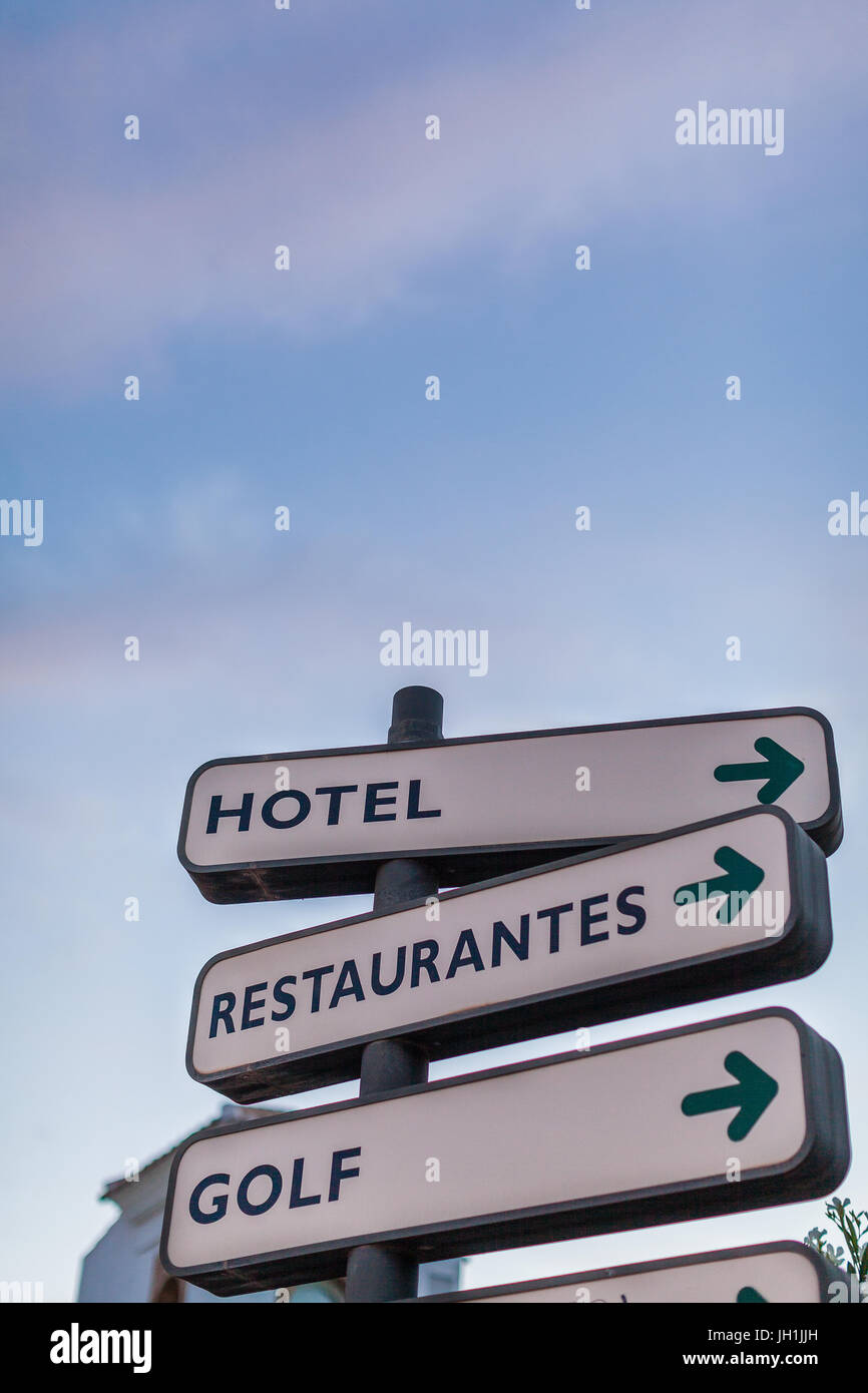 Sign post for hotel resyaurants and golf Stock Photo - Alamy