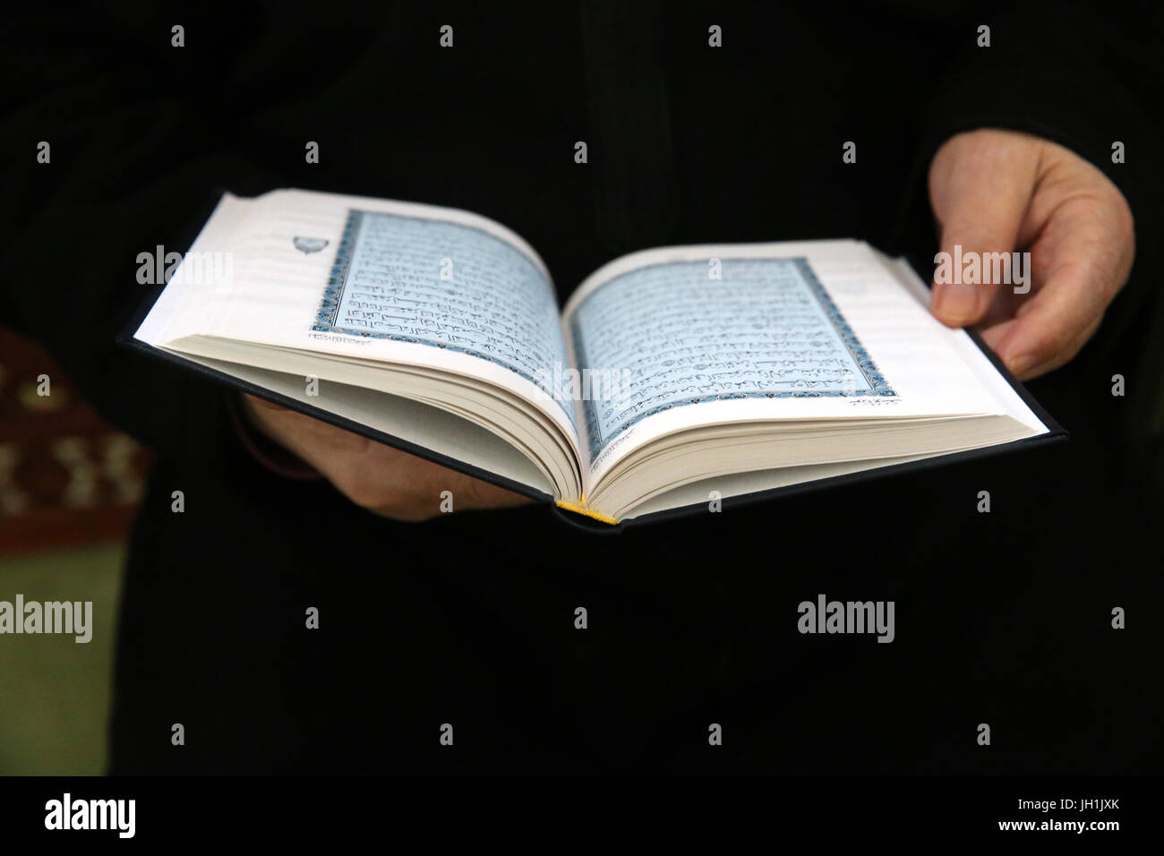 Muslim man reading quran in the mosque hi-res stock photography and ...