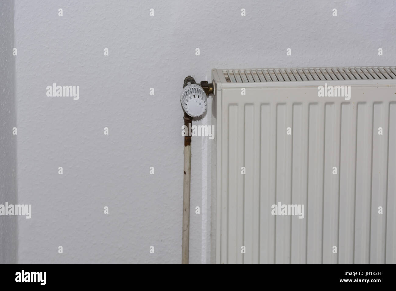 Old panel radiators in a renovated room Stock Photo - Alamy