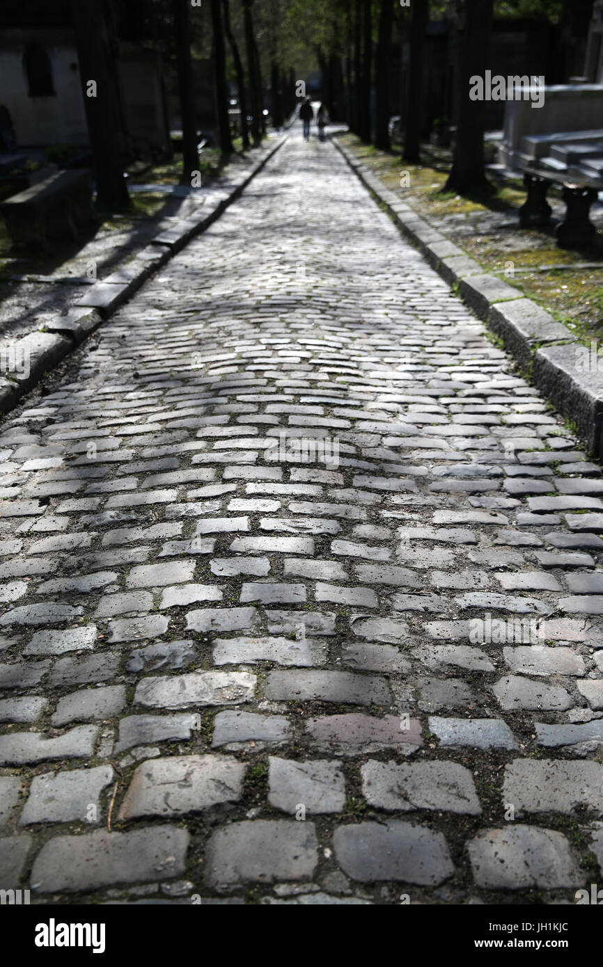 Cobblestone path leading to Pere Lachaise cemetery. Paris. France Stock ...
