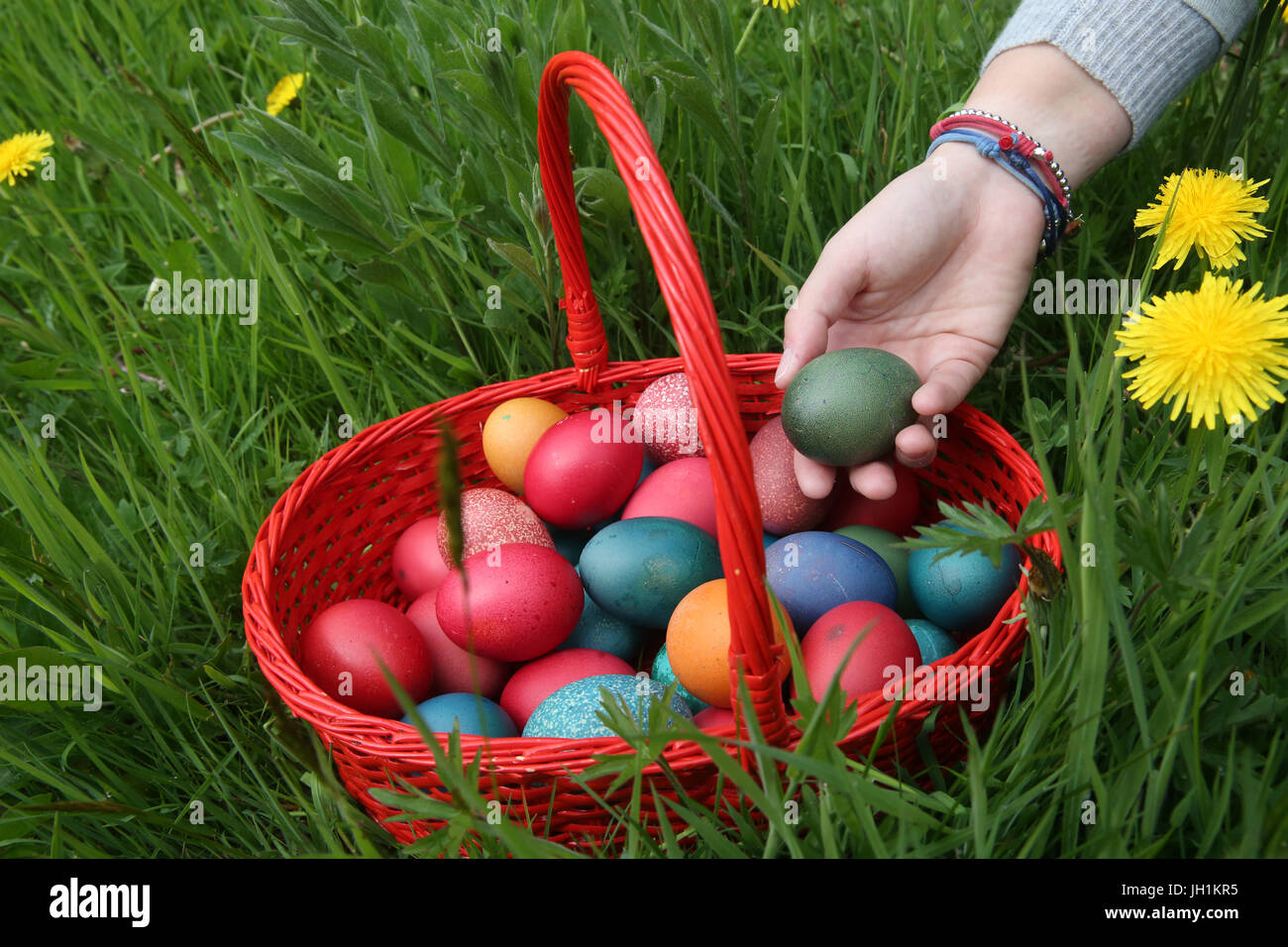 Colored easter eggs in woman hi-res stock photography and images - Alamy